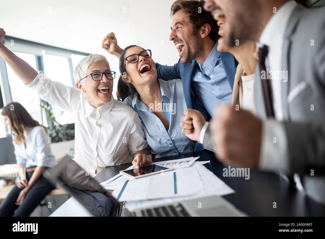 Business team celebrating a good job in the office Stock Photo - Alamy
