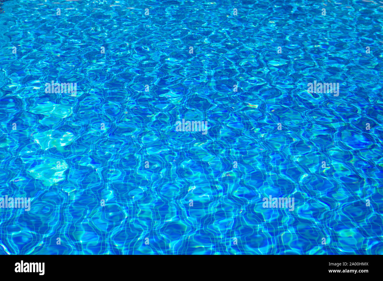 Transparent clear water in the pool. blue mosaic tiles, water texture ...