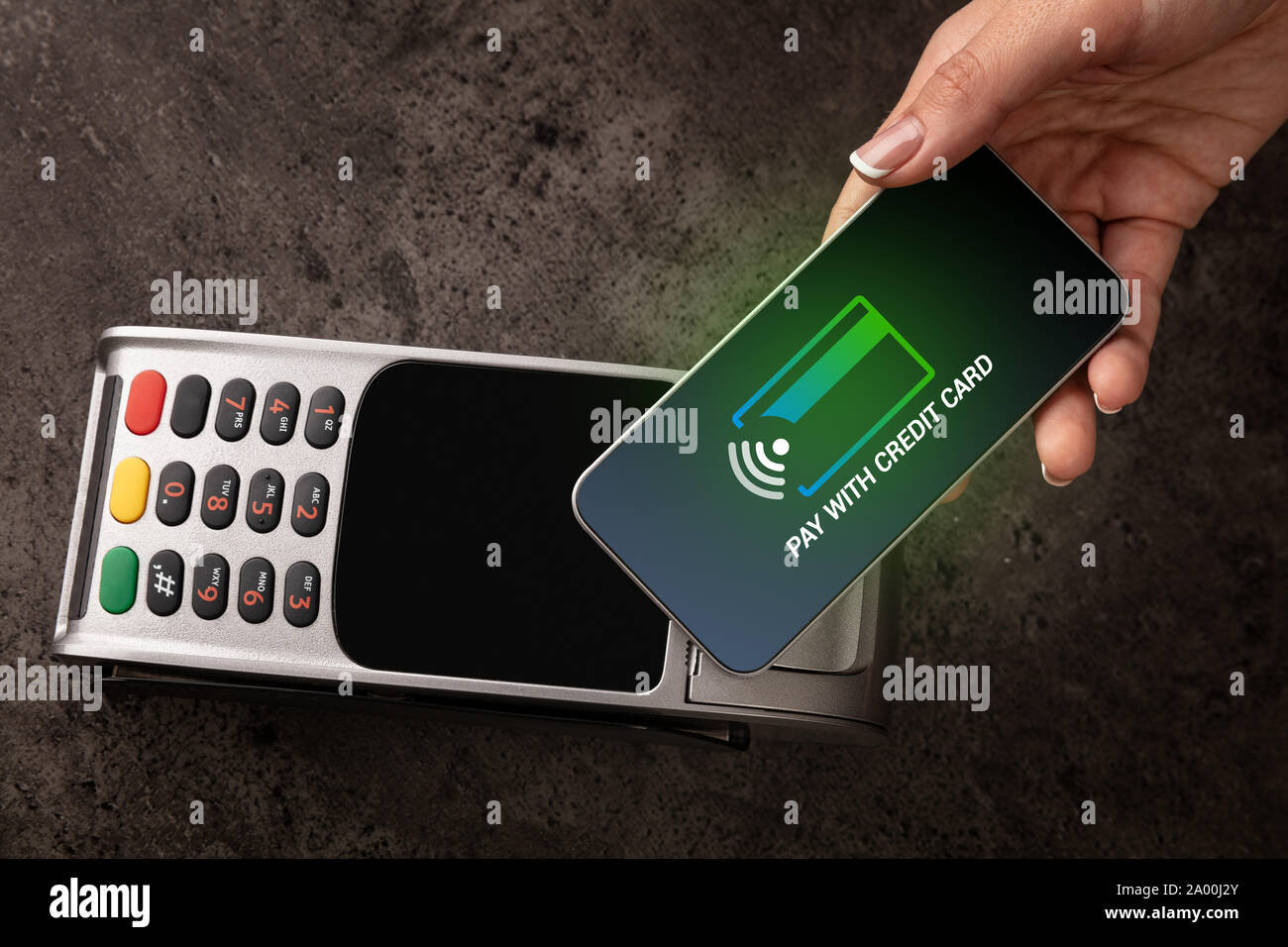 Payment accepted on terminal with mobile phone Stock Photo - Alamy