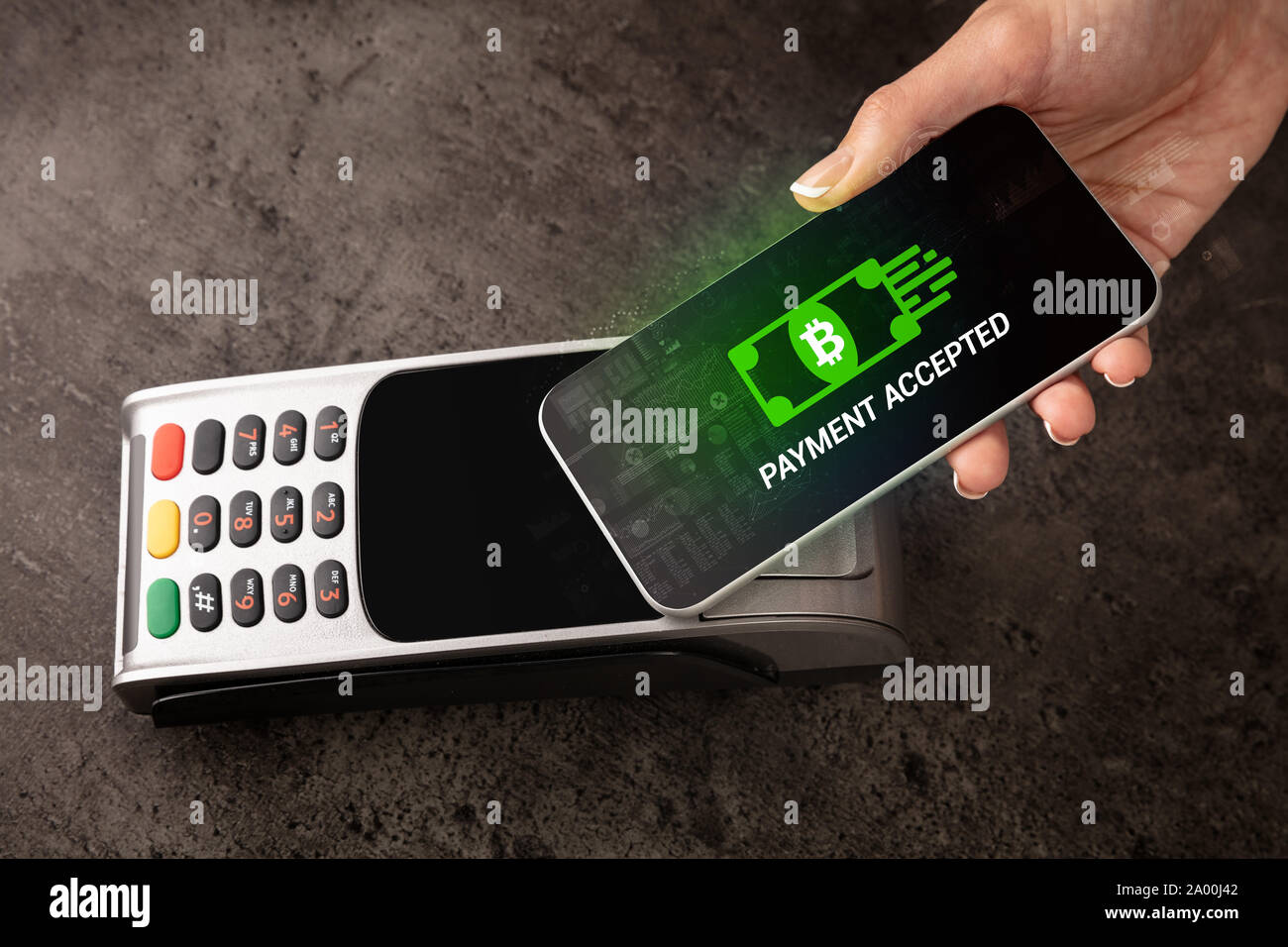 Hand paying with digital currency from smartphone Stock Photo - Alamy