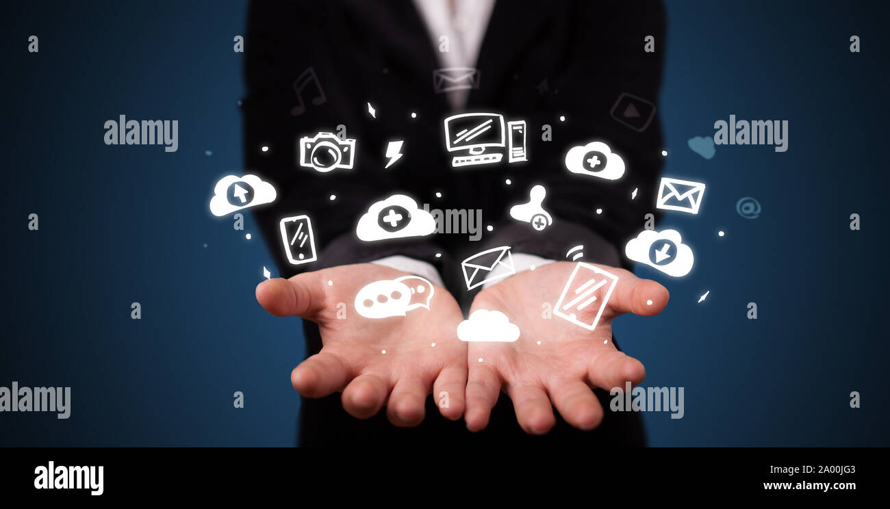 Hand holding application icons and symbols in her hand Stock Photo - Alamy