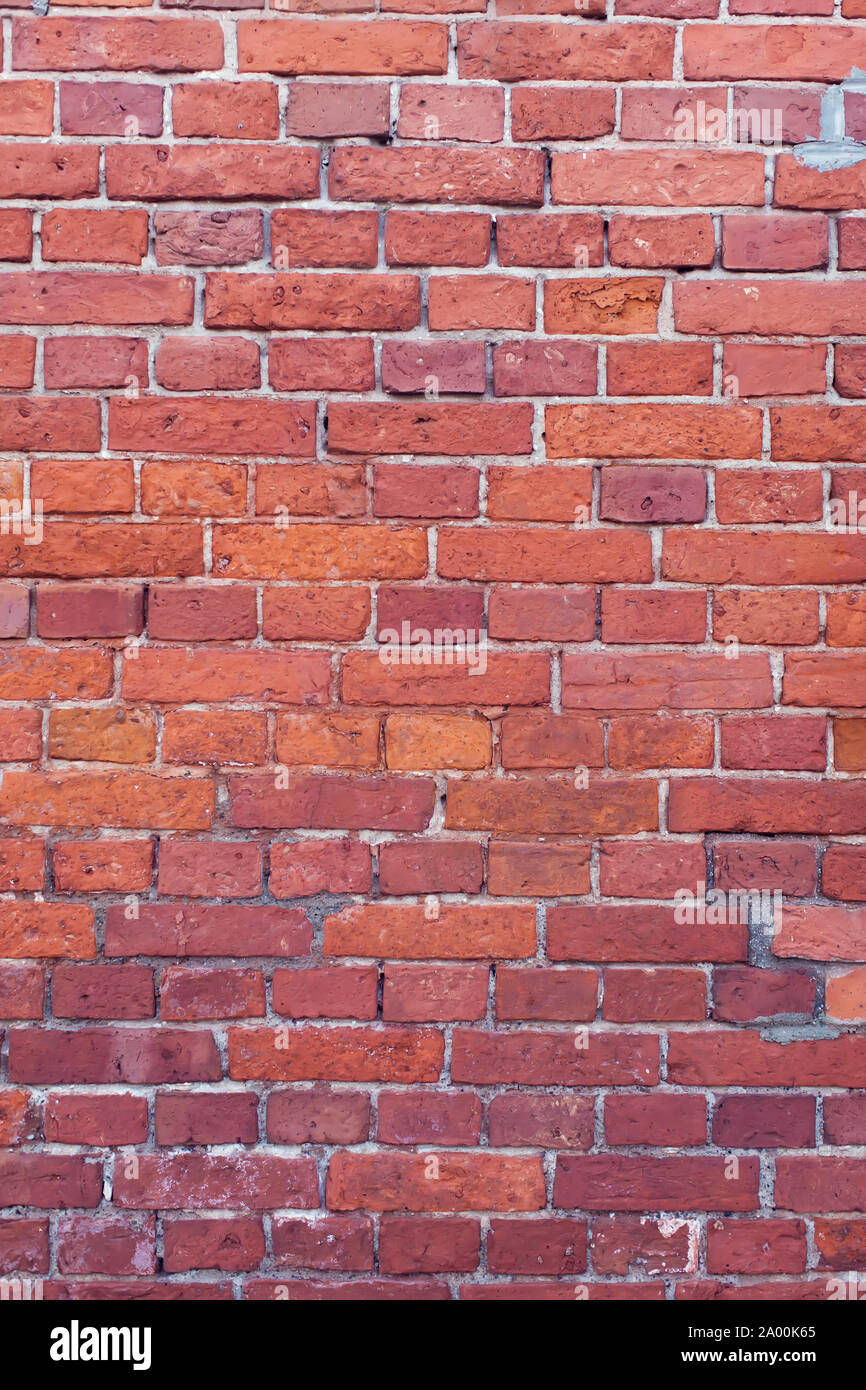 Vertical red bricks background. A part of wall of the building Stock ...