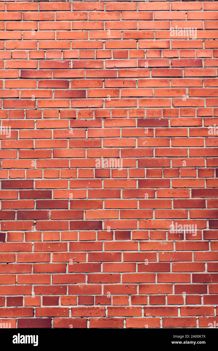 Vertical red bricks background. A part of wall of the building Stock ...
