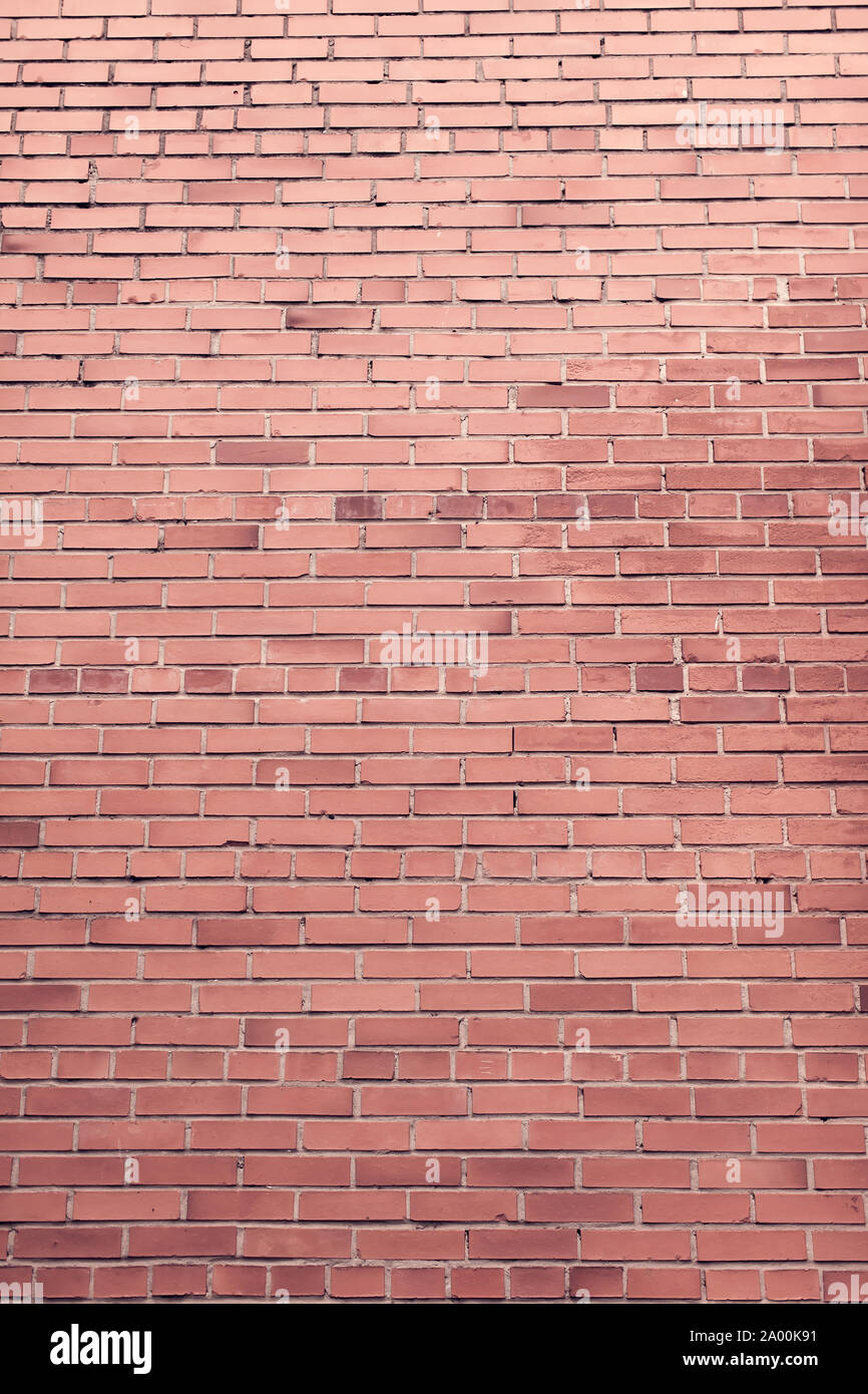 Vertical red bricks background. A part of wall of the building Stock ...