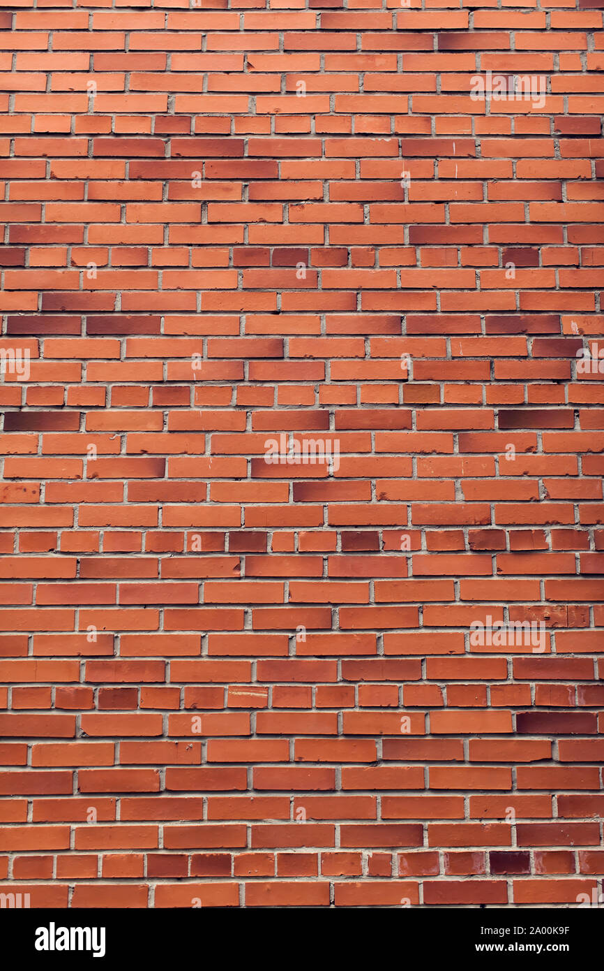 Vertical red bricks background. A part of wall of the building Stock ...