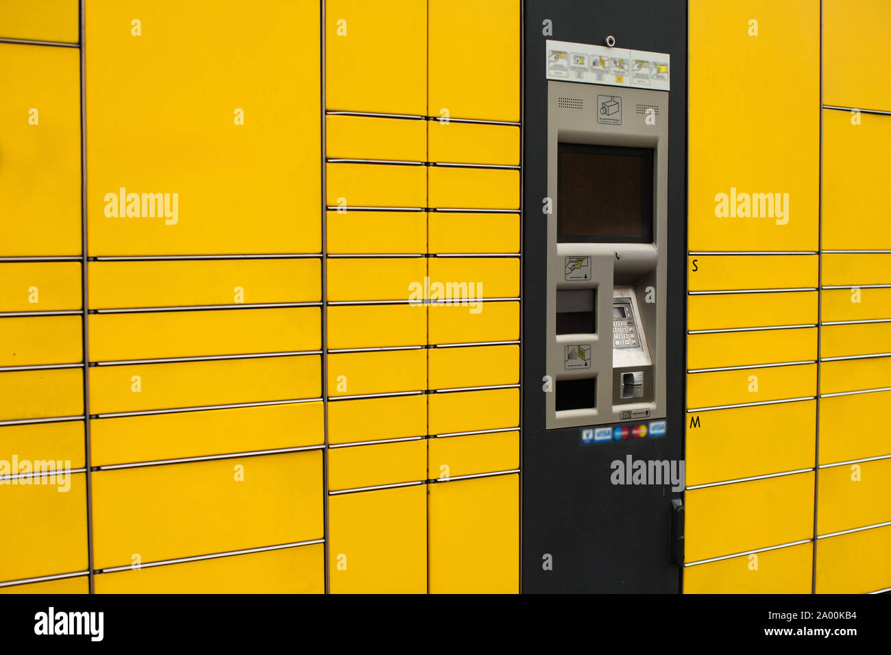 Yellow self-service automated post terminal machine for parcel Stock ...