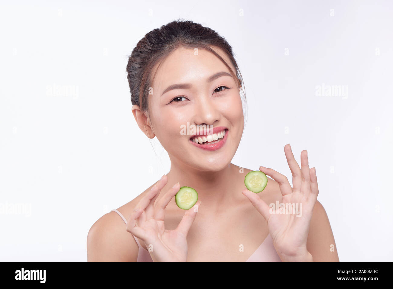 Woman eating cucumber hi-res stock photography and images - Alamy