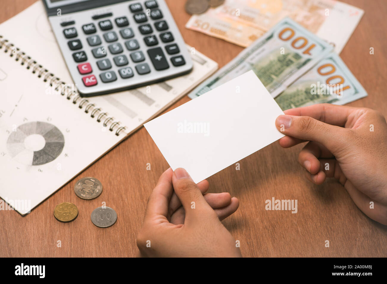 Financial accounting. Male hands holding blank paper Stock Photo - Alamy