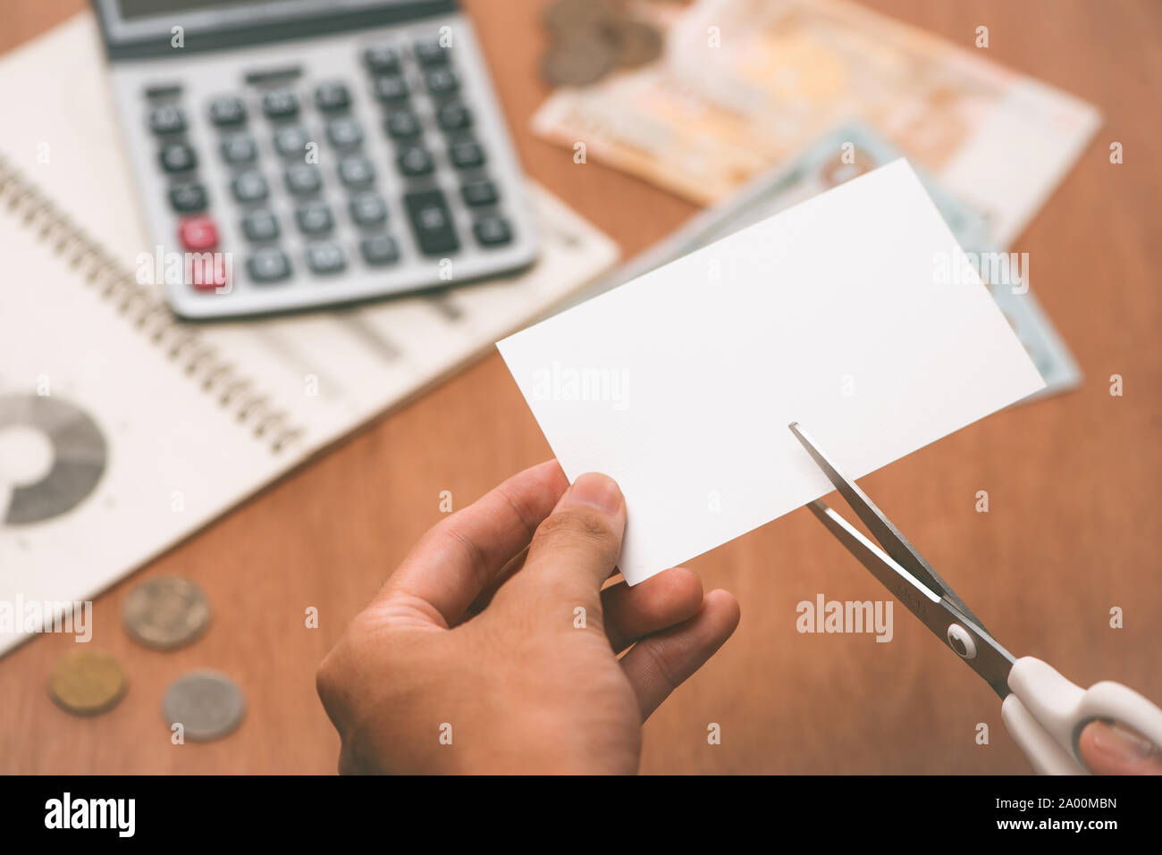 Male hands cutting piece of paper by scissors Stock Photo - Alamy