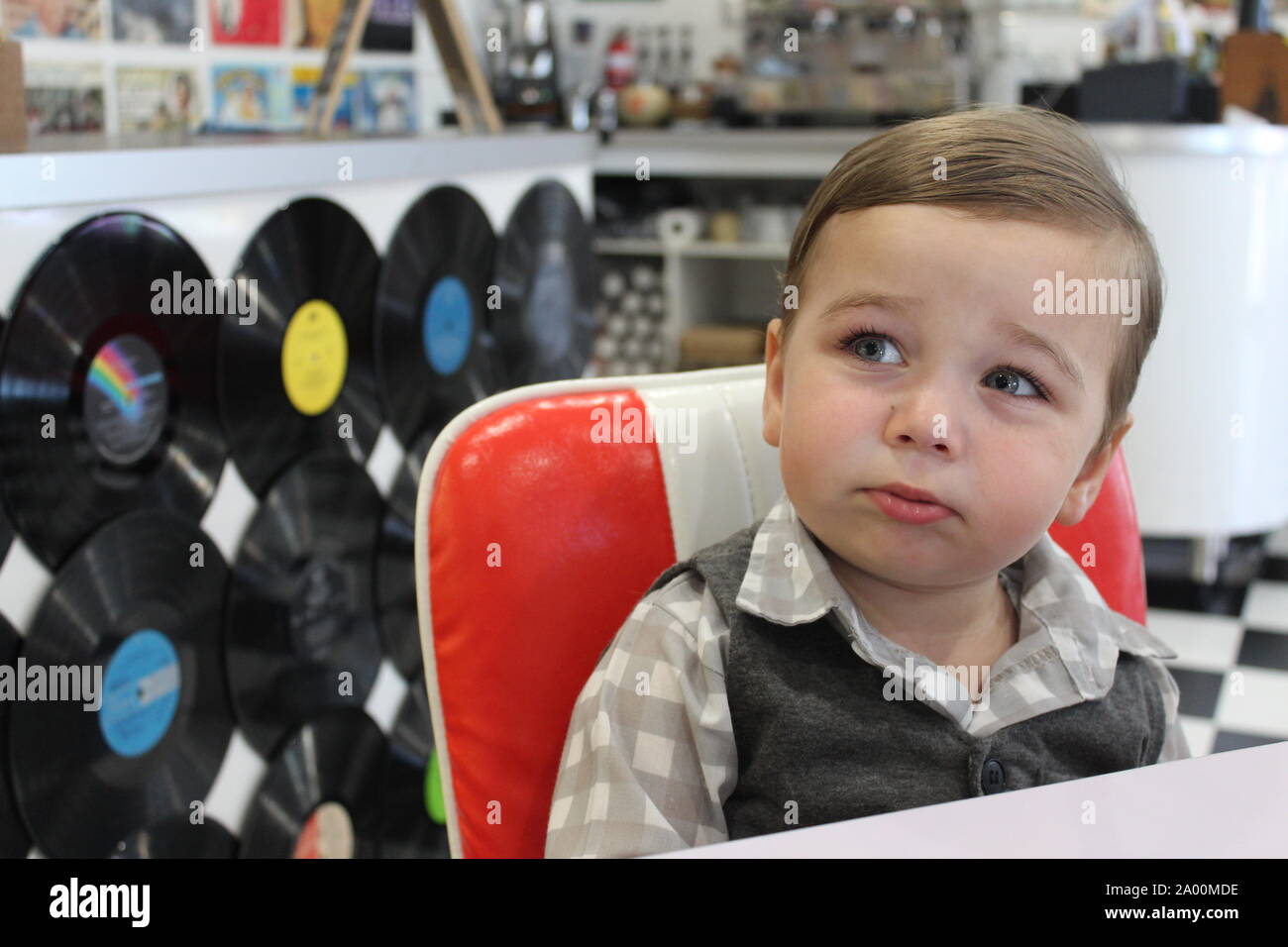 Little boy in retro diner Stock Photo - Alamy
