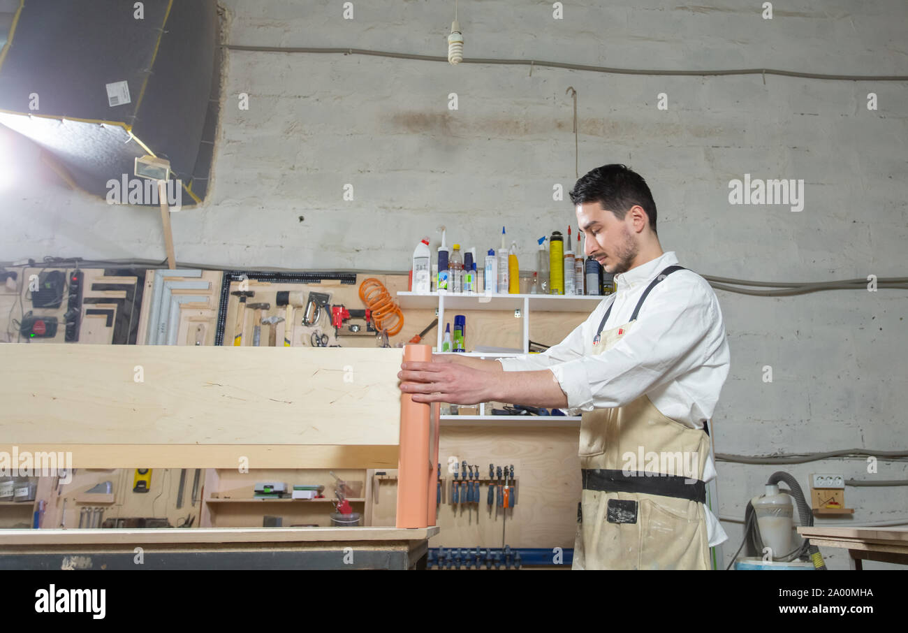 Small-Sized Companies, furniture and worker concept - Handsome young ...