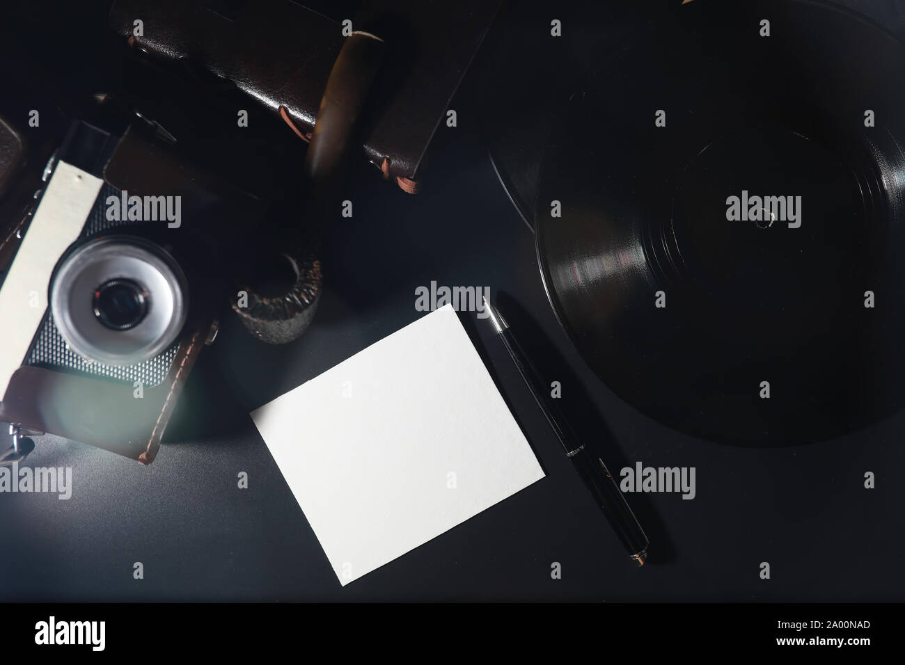 Vinyl plate and retro camera Stock Photo - Alamy
