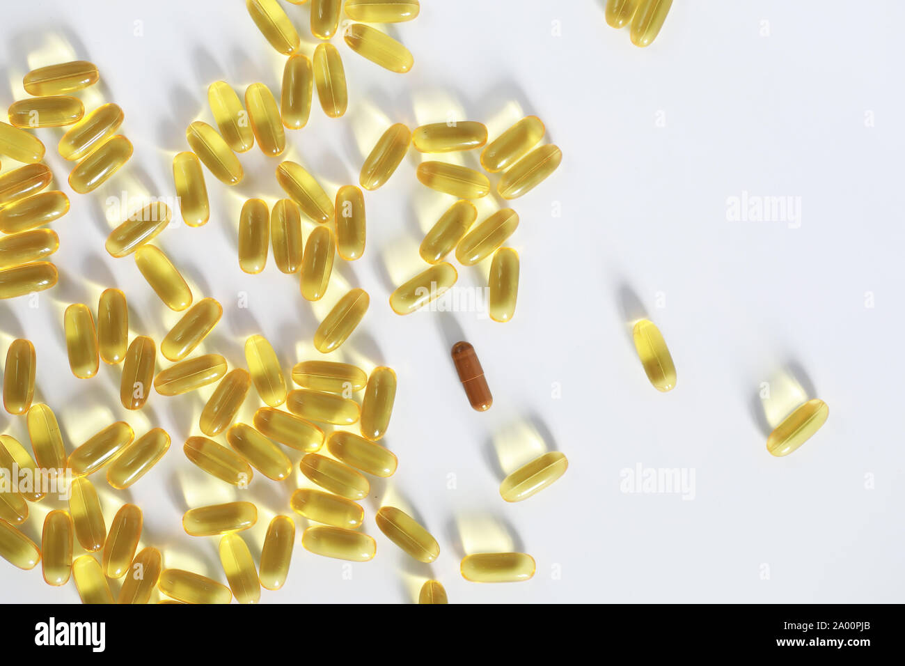 Medical drugs transparent capsules of yellow color Stock Photo - Alamy