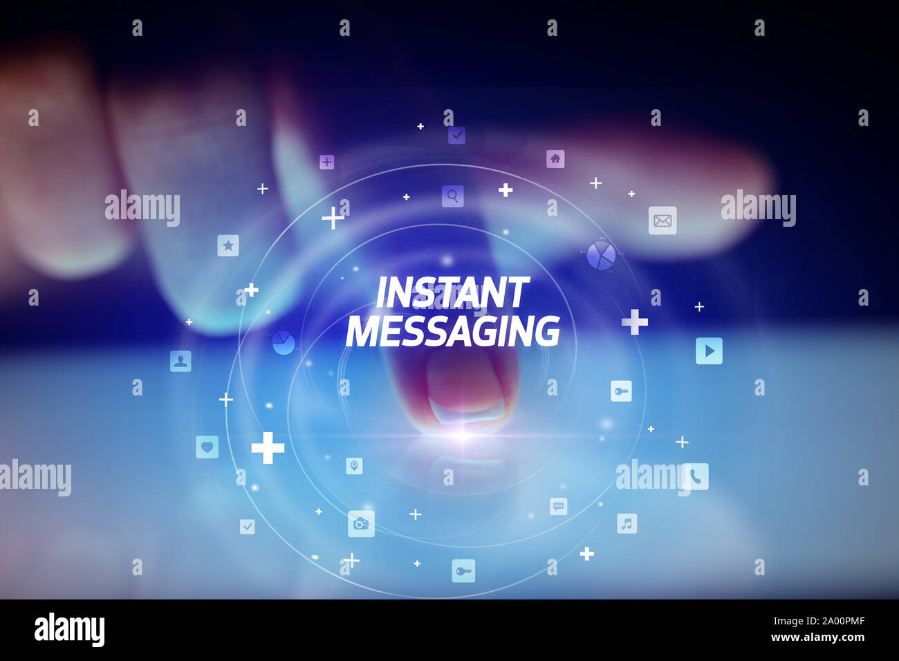 Finger touching tablet with social media icons and INSTANT MESSAGING ...
