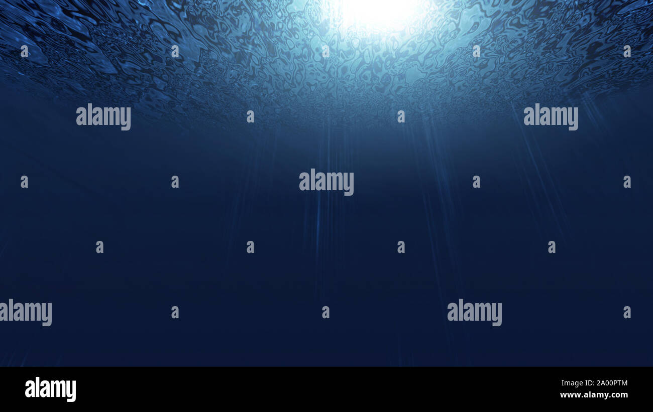 An underwater scene with sun rays shining through the water Stock Photo ...