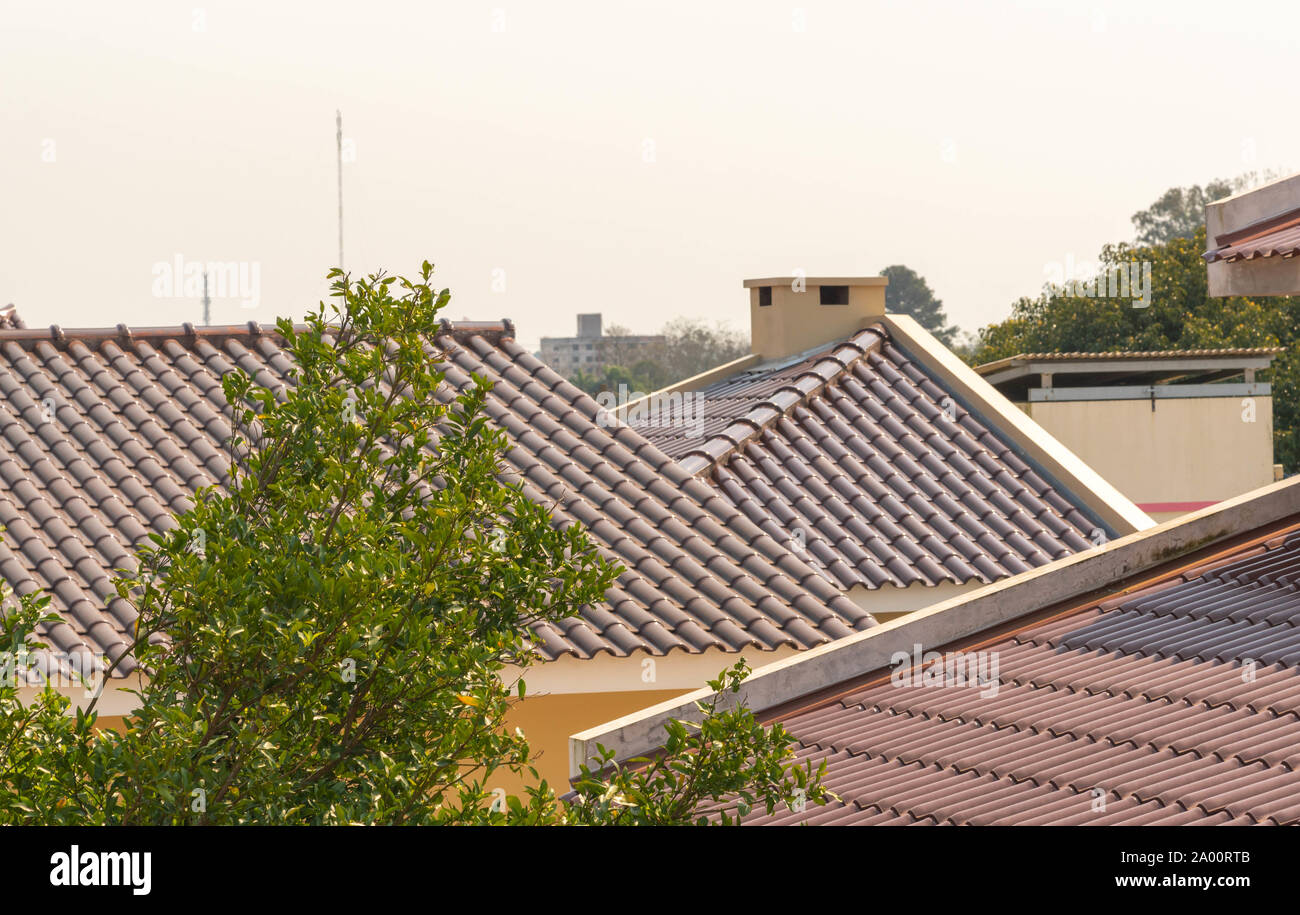 View of different roofs constructed of clay tiles in residential ...