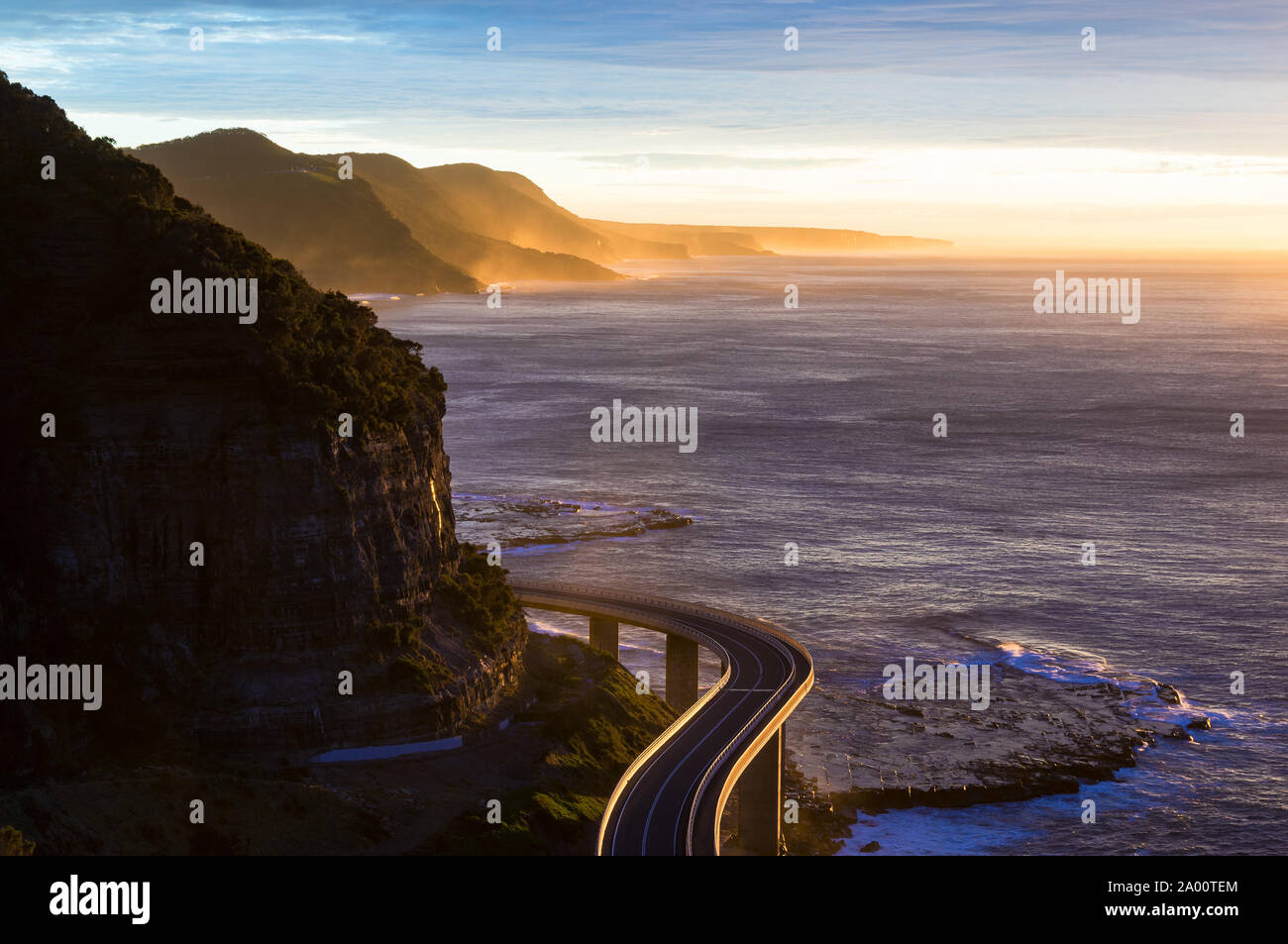 Sea Cliff Bridge on sunrise. Vertical shot of famous bridge between ...
