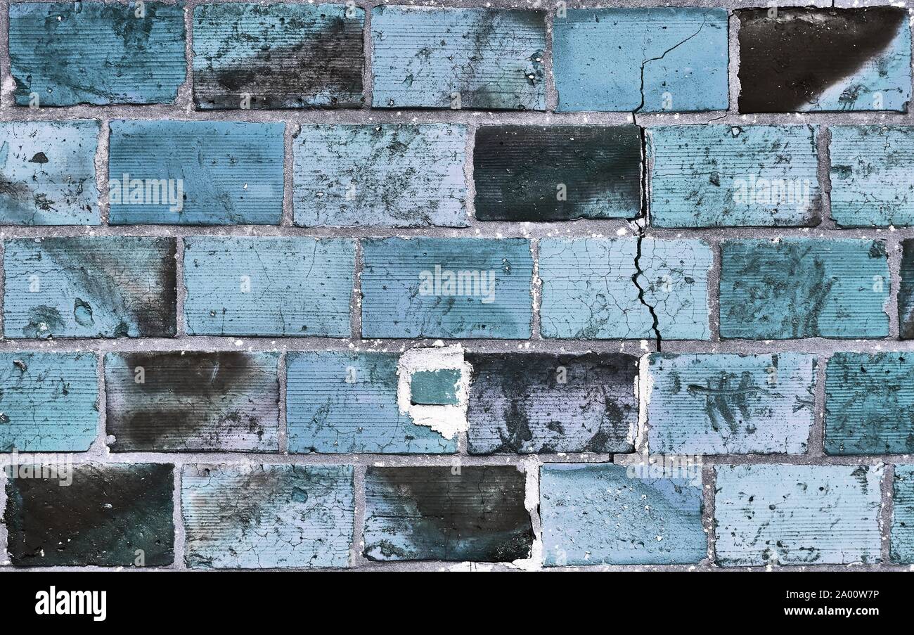 Detailed close up view on weathered blue brick walls at aged buildings ...