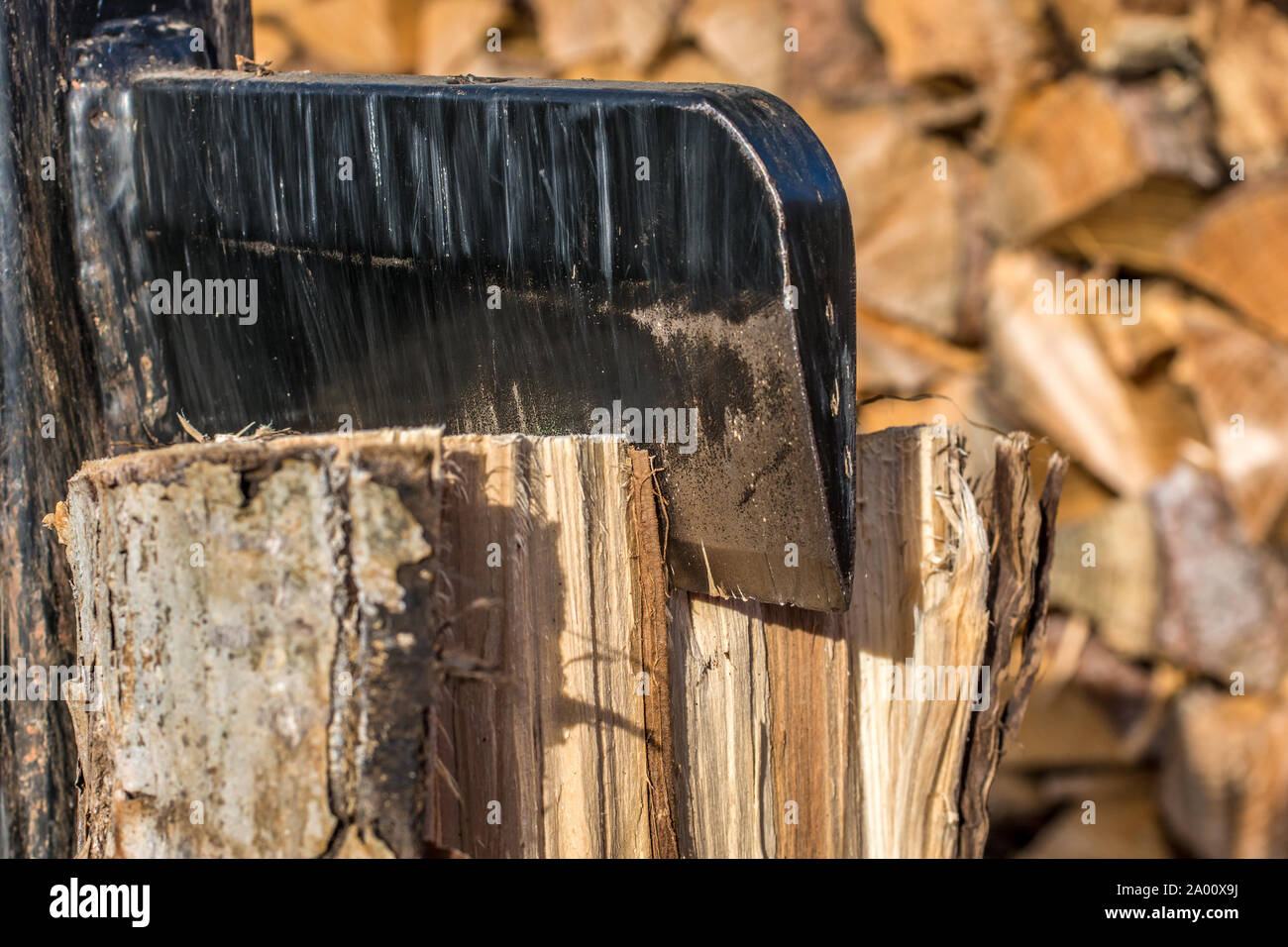 Sharp wood splitter splits even thick wood Stock Photo - Alamy