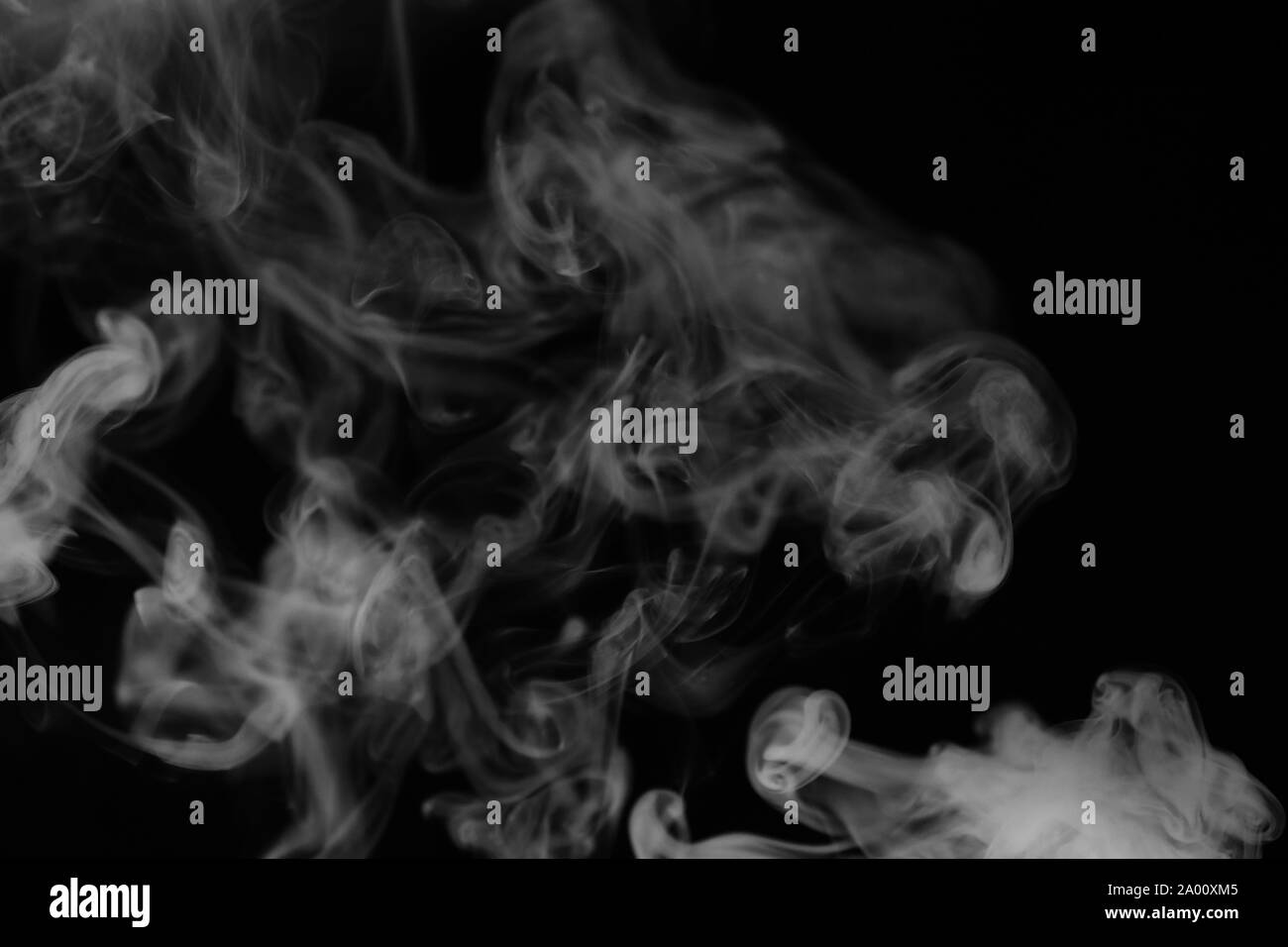 White smoke on a black background. Texture of smoke. Clubs of white ...