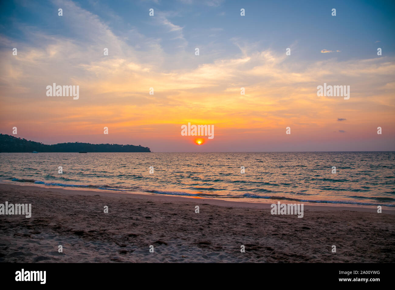 sunset on the sea. sandy beach, clear water, waves Stock Photo - Alamy
