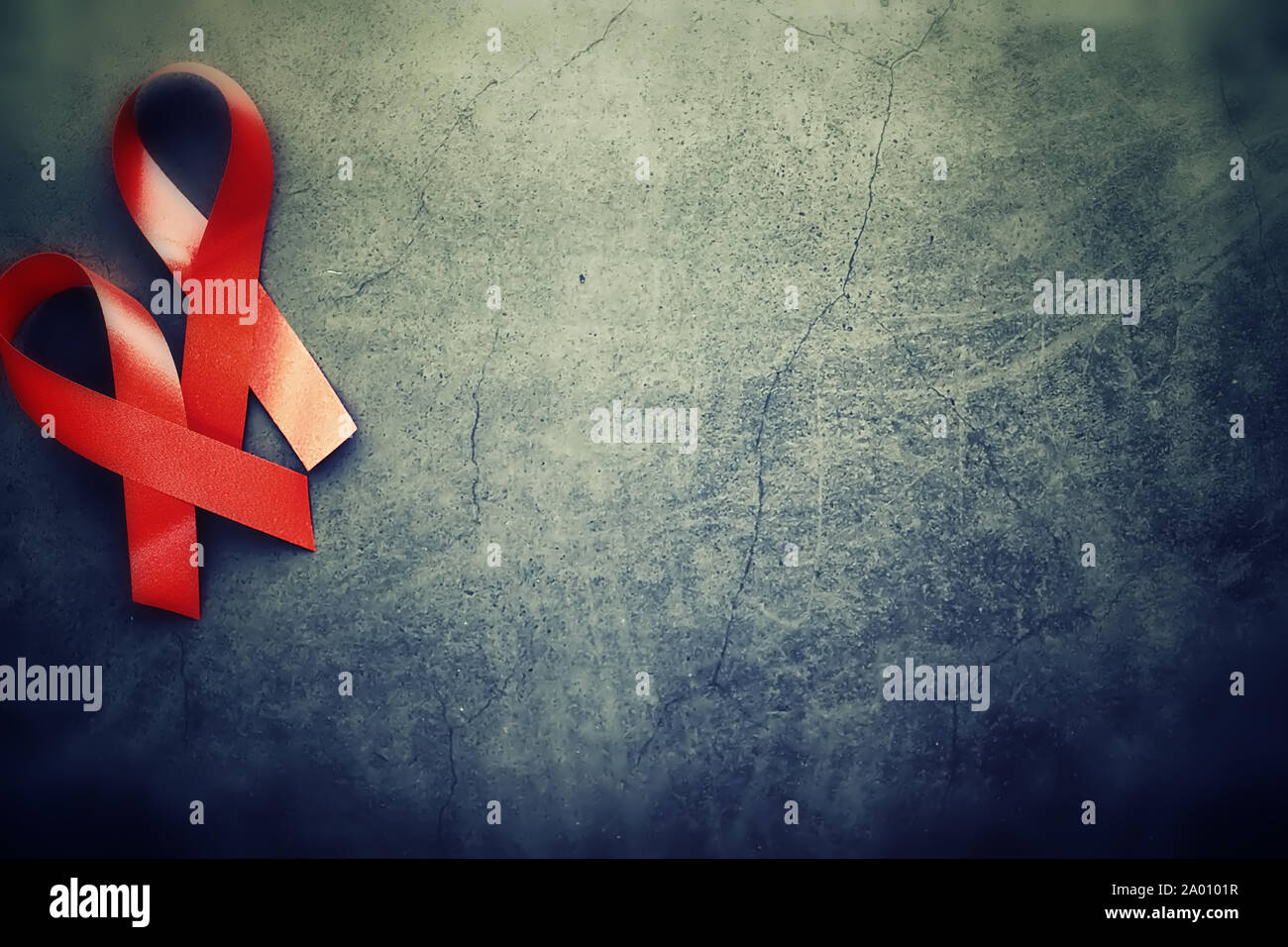 Symbol of human immunodeficiency virus disease. Red ribbon. A helping ...