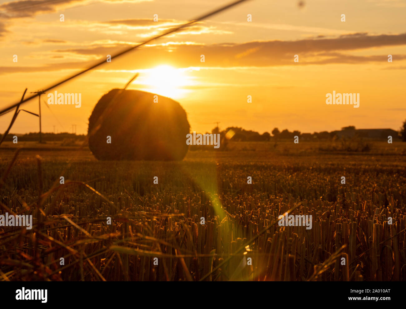 Hay bale at sunset hi-res stock photography and images - Alamy