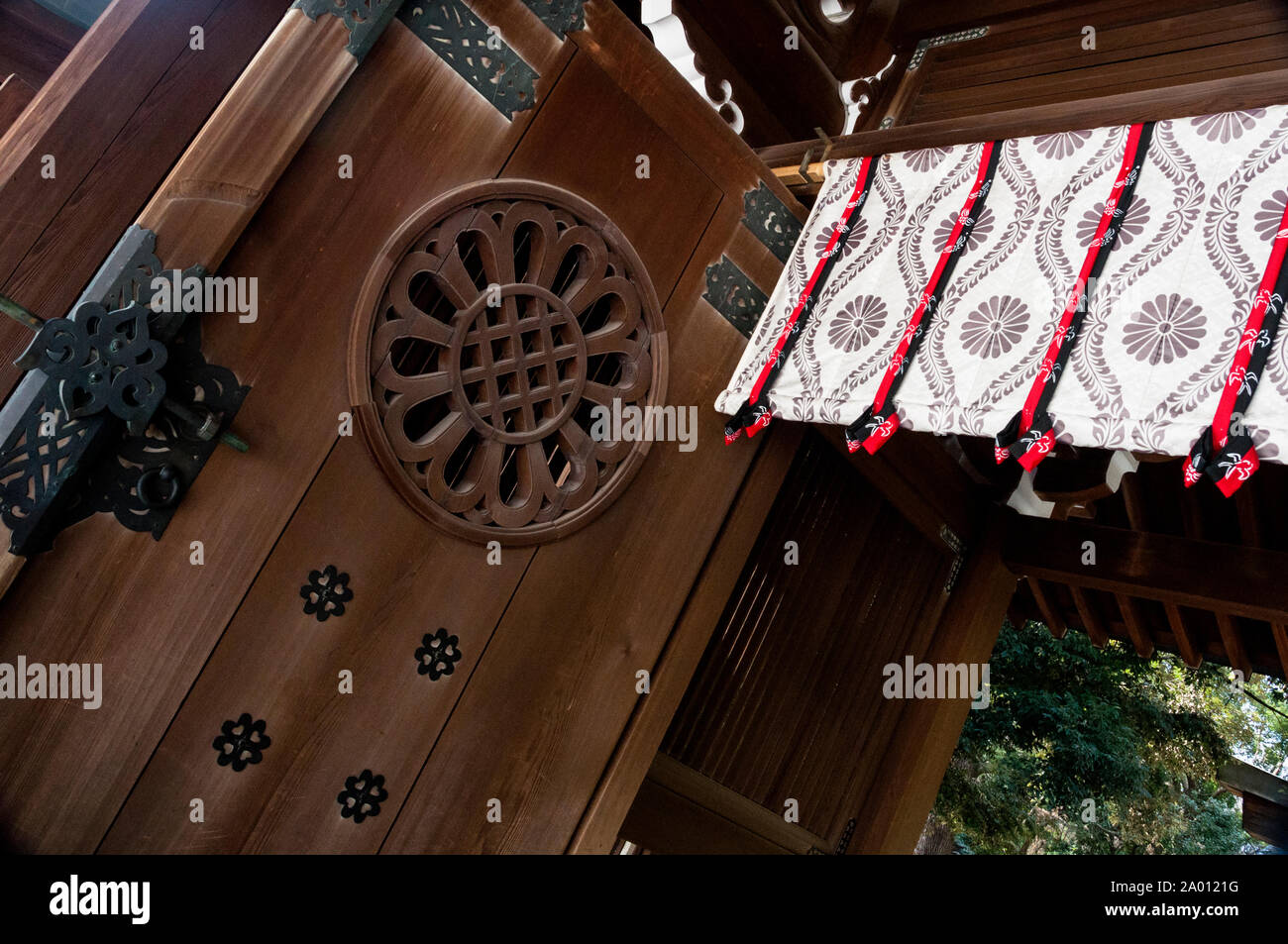 Meiji Shinto Shrine in Tokyo, Japan massive carved door softened by a ...