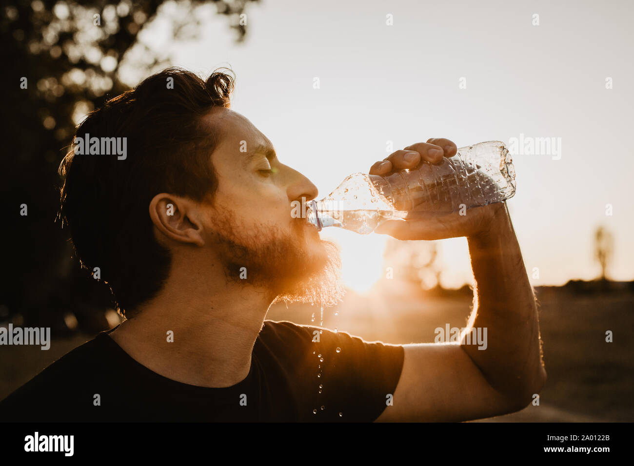Bearded man drinking from plastic hi-res stock photography and images ...