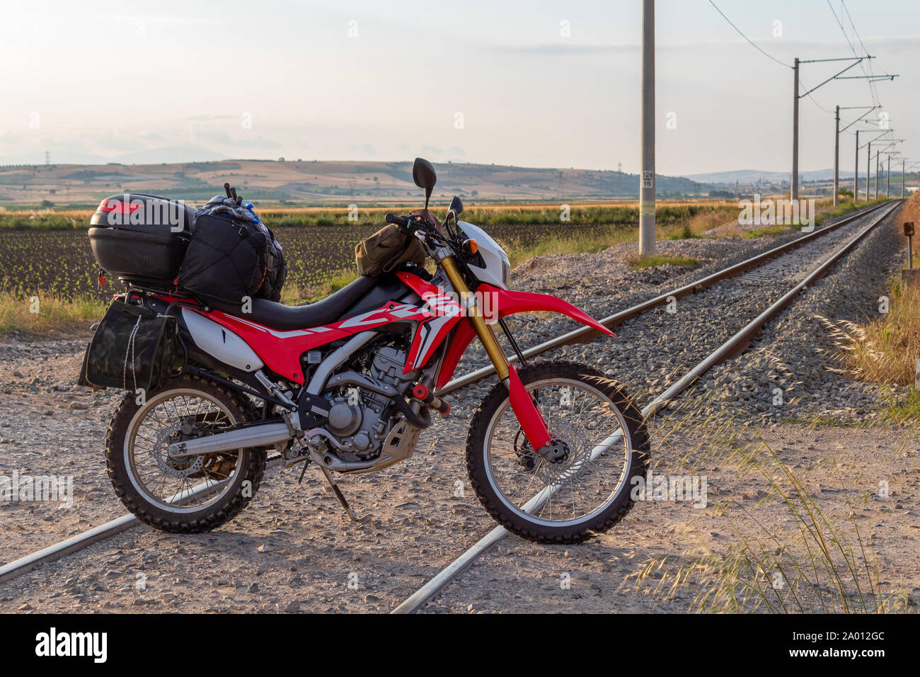 Motorcycle loaded on the bag, on train tracks Stock Photo - Alamy