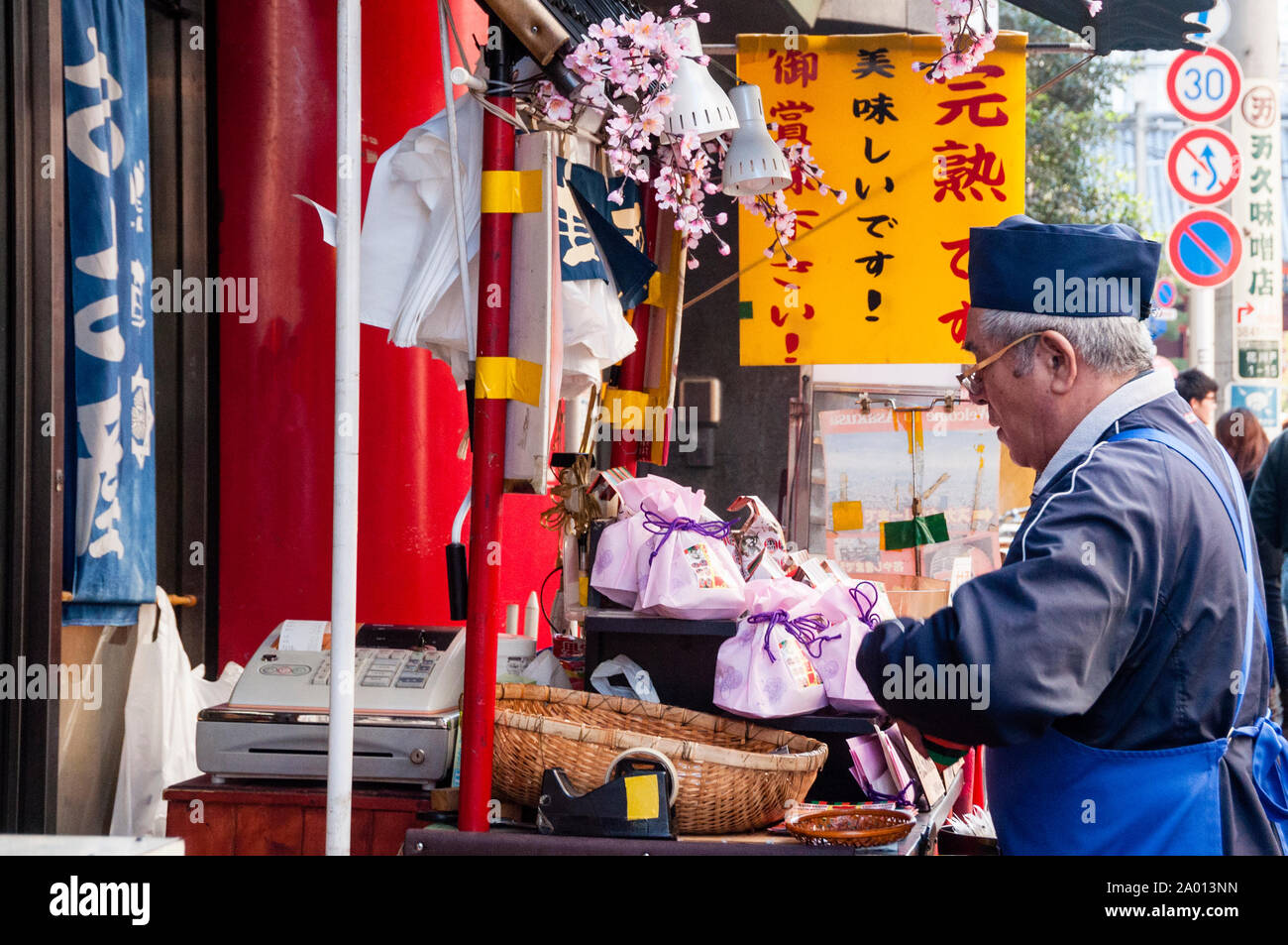 Japanese vendor in Tokyo wraps his products carefully, a custom I was ...