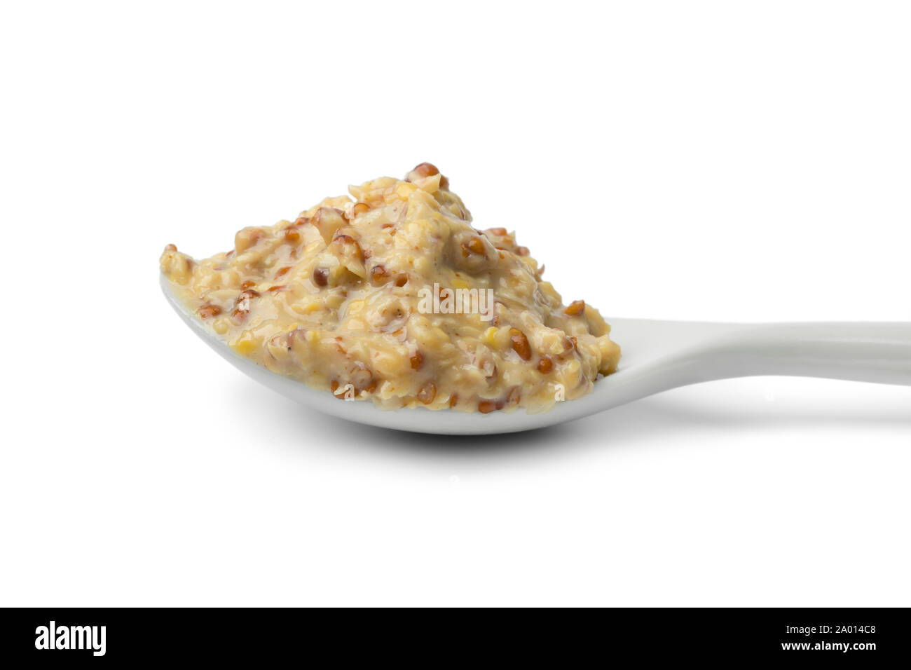 Traditional Dutch mustard on a white spoon isolated on white background ...