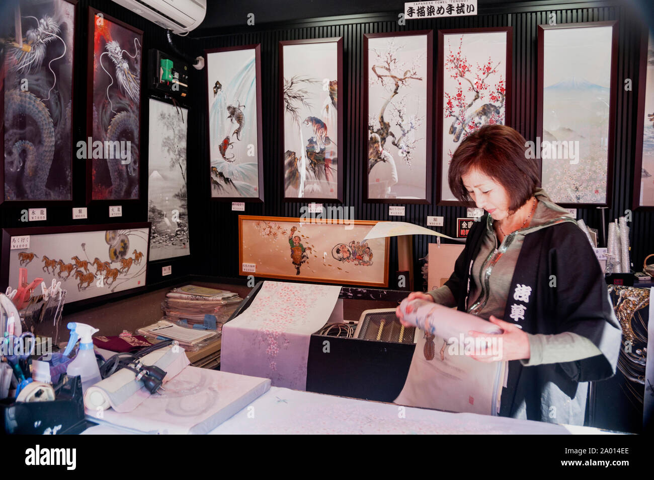 Japanese scroll artist in Tokyo, near the historic Asakusa Temple Stock ...