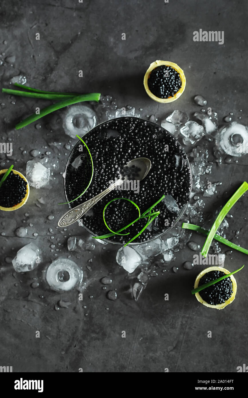 Fresh black fish roe. Beluga caviar served with ice Stock Photo - Alamy