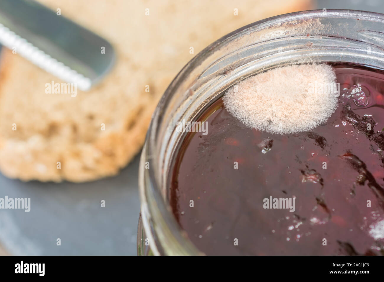 Mold on jam as a symbol of expired food Stock Photo - Alamy