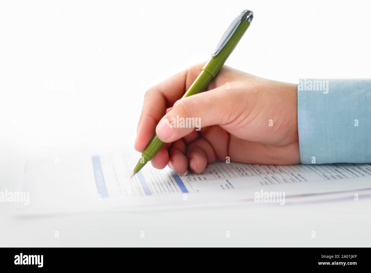 Picture of man working paperwork with a pen. Isolated on a white ...