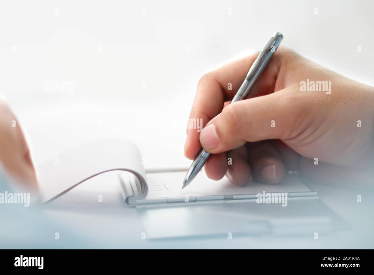 Picture of man working paperwork with a pen. Isolated on a white ...