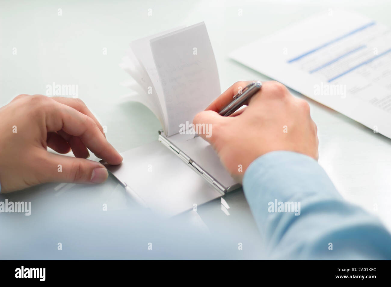 Picture of man working paperwork with a pen. Isolated on a white ...