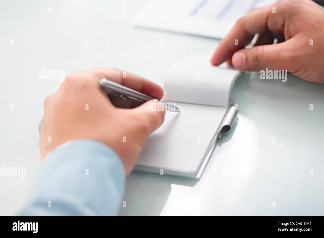 Picture of man working paperwork with a pen. Isolated on a white ...