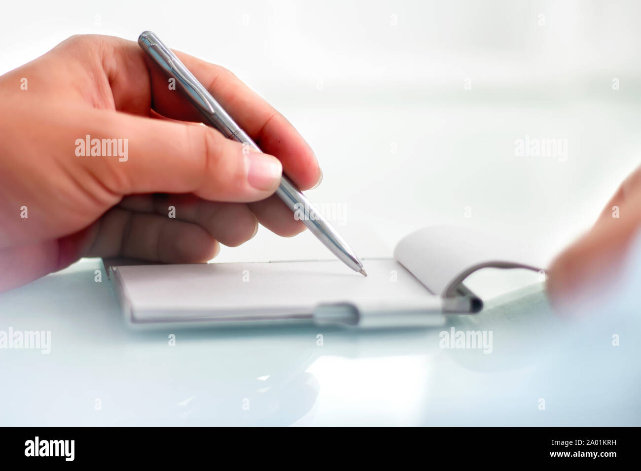 Picture of man working paperwork with a pen. Isolated on a white ...