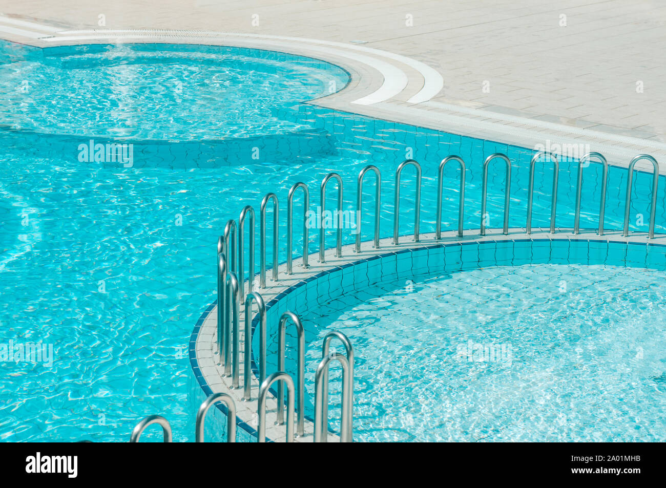 Beautiful refreshing clear blue water in the outdoor pool. Metal ...