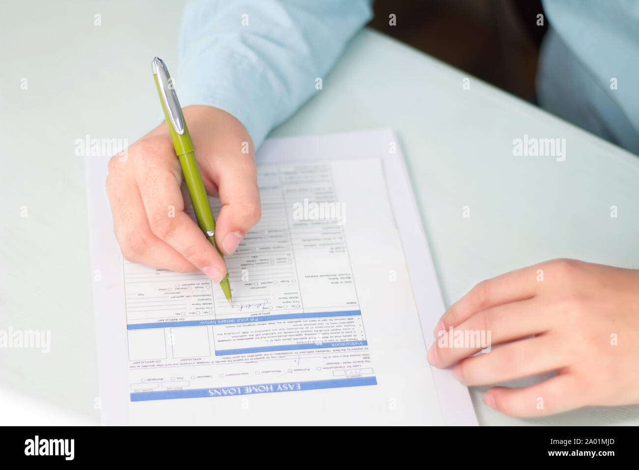 Picture of man working paperwork with a pen. Isolated on a white ...