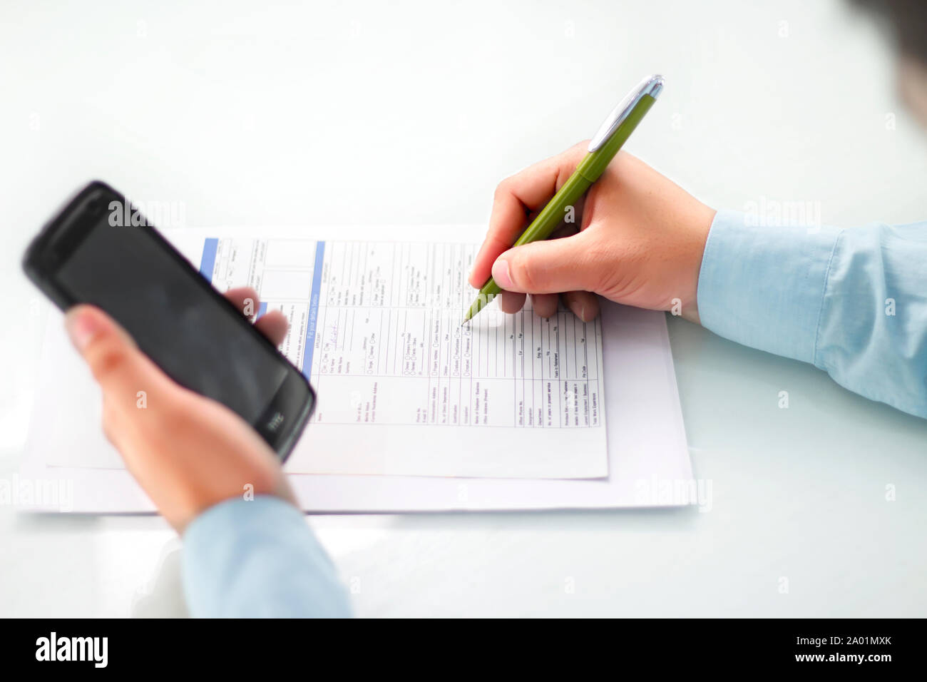 Picture of man working paperwork with a pen. Isolated on a white ...