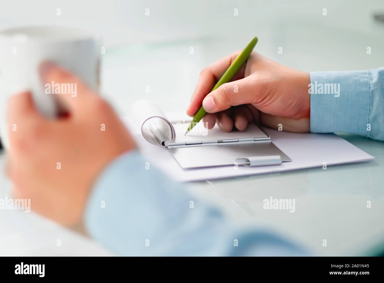 Picture of man working paperwork with a pen. Isolated on a white ...