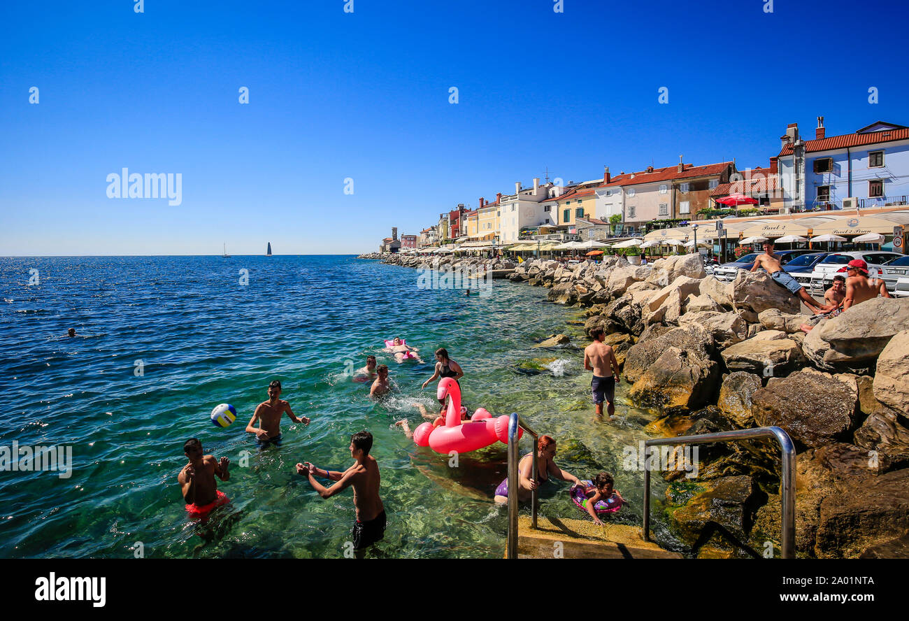 Piran, Istria, Slovenia - Beach life at the city beach of the port city ...