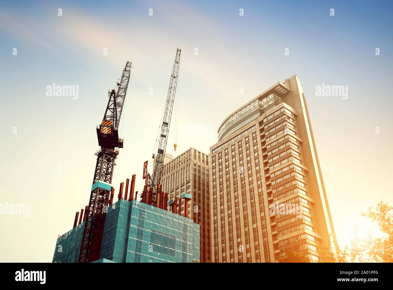 Building construction site, tall skyscrapers and cranes Stock Photo - Alamy