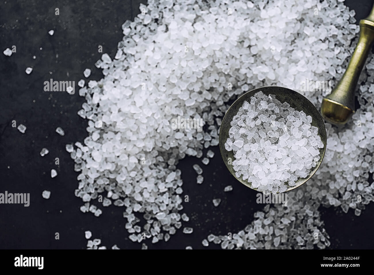 Large sea salt. Spice. Mortar and pestle for grinding Stock Photo - Alamy