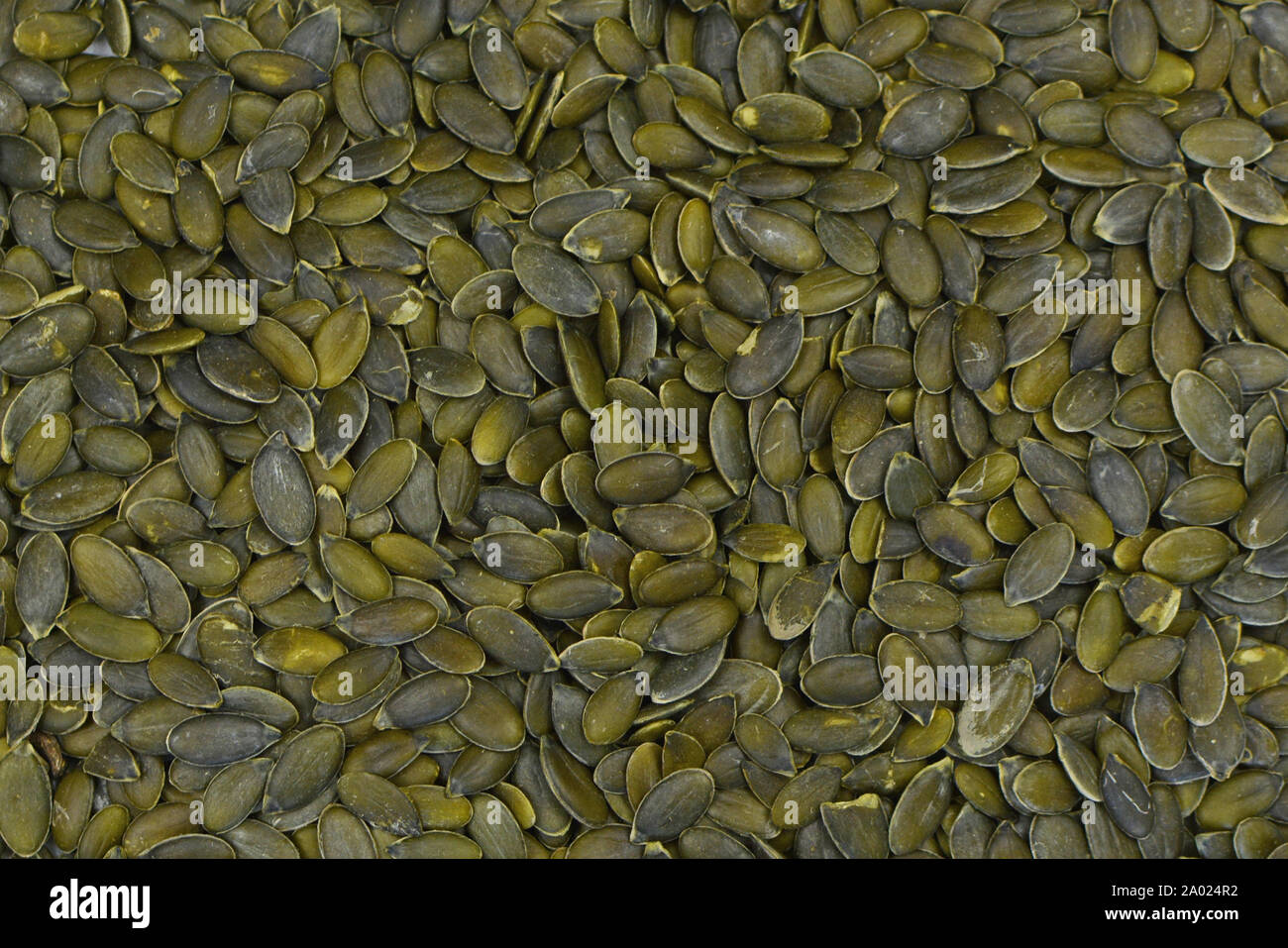 Top view of green dried shell free pumpkin seeds food background Stock ...
