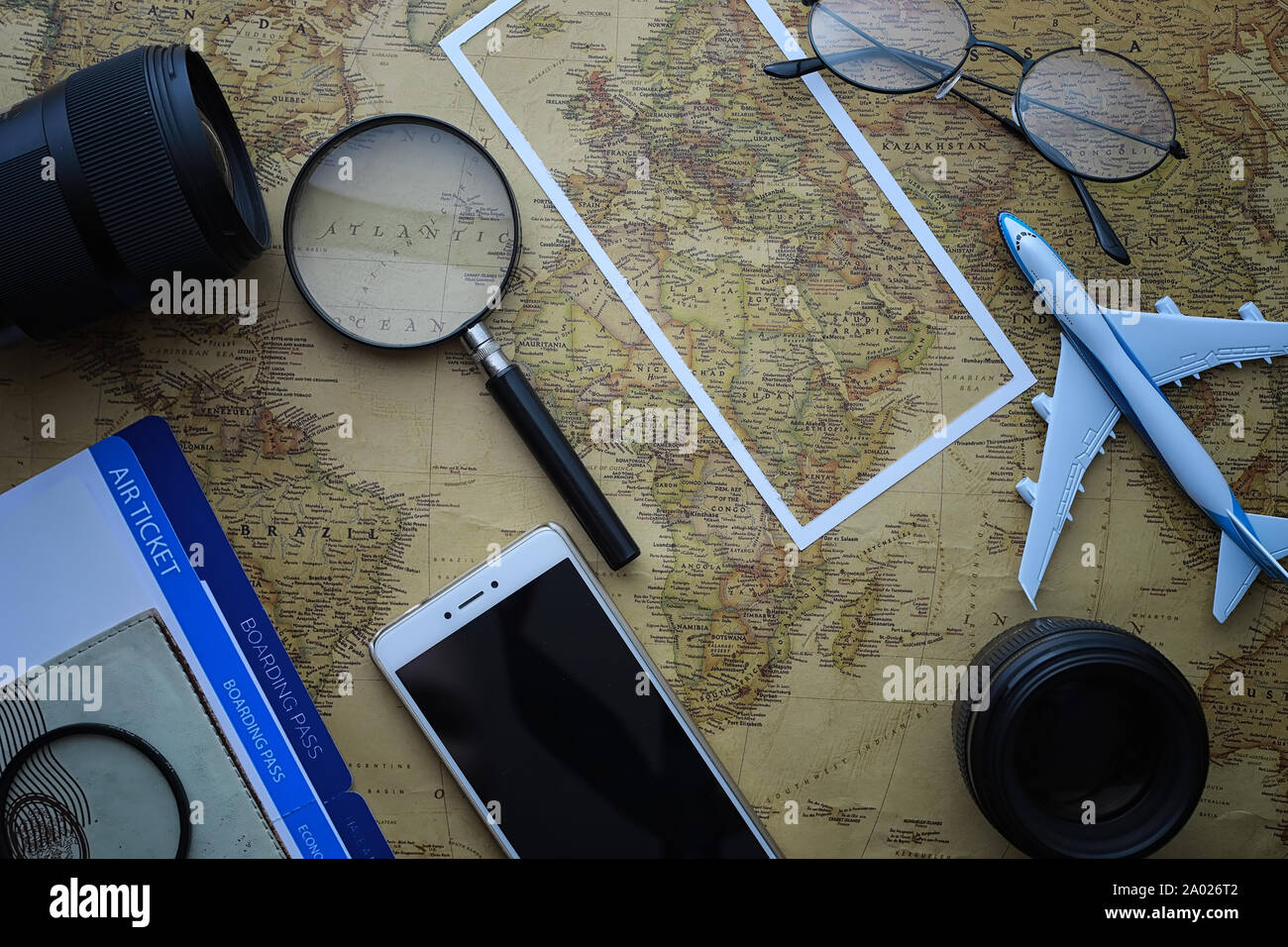 Travel concept. Map on the table andl aircraft Stock Photo - Alamy