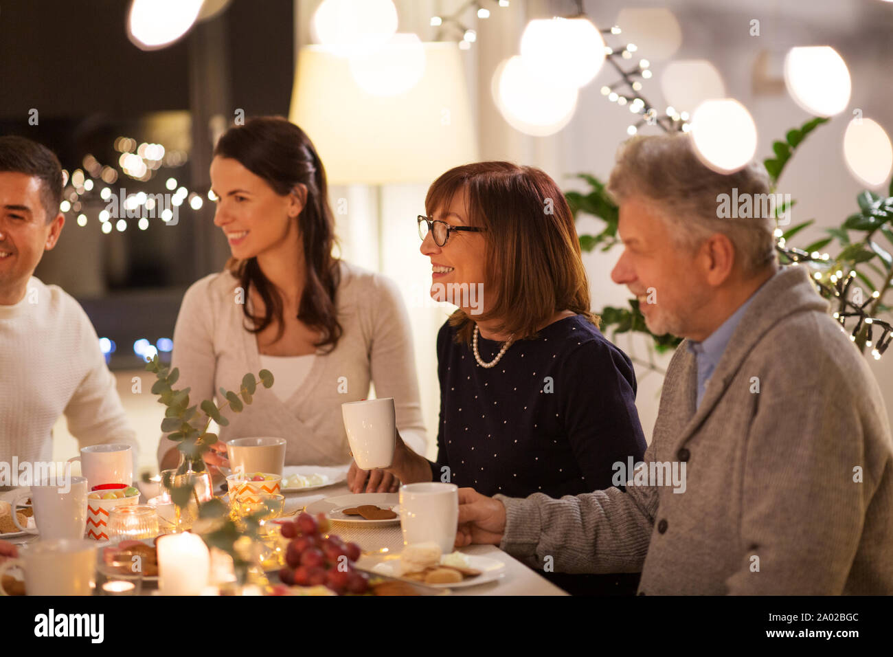 happy family having tea party at home Stock Photo - Alamy